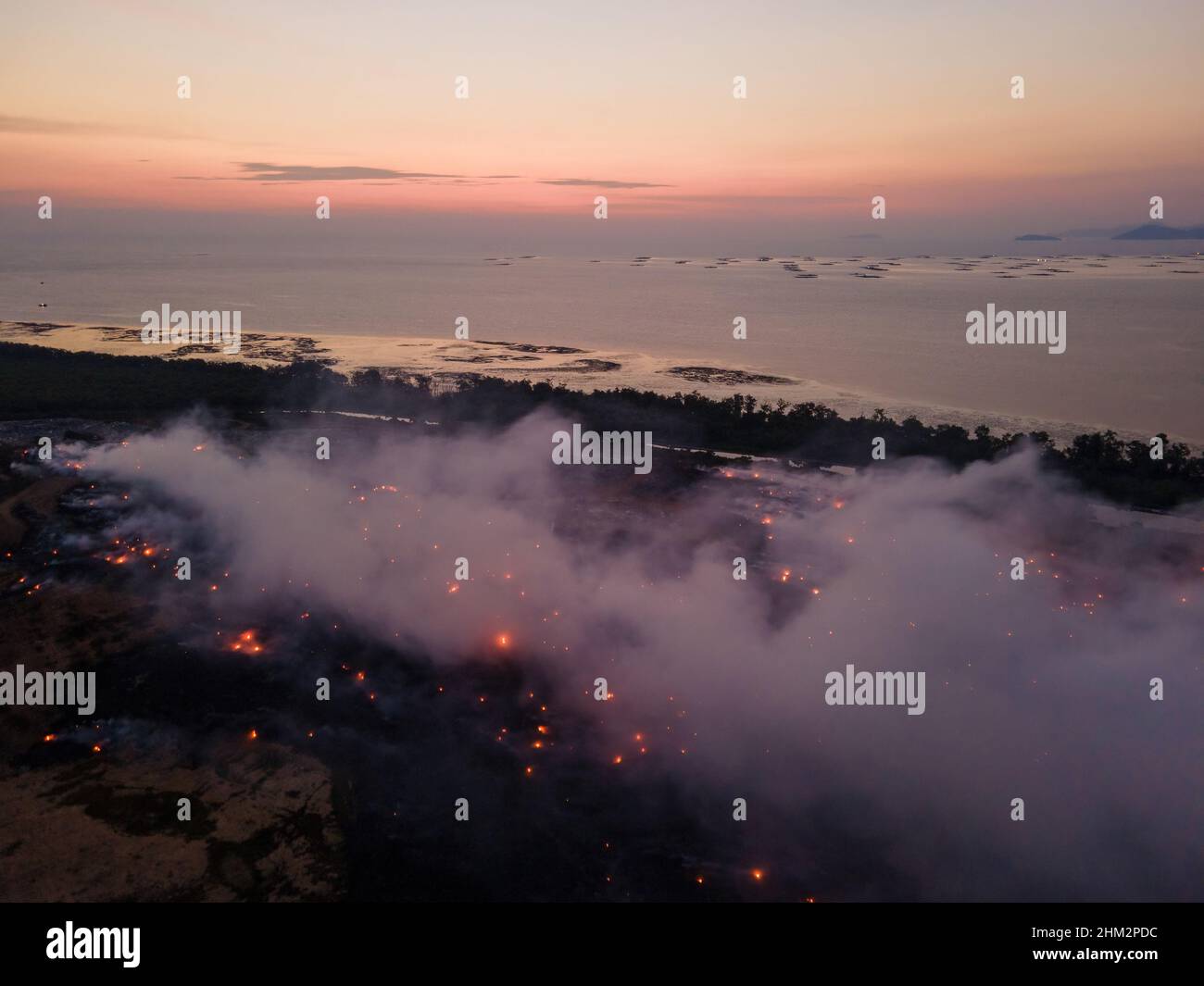 Aerial shot of thick smoke from the burning of a landfill Stock Photo ...