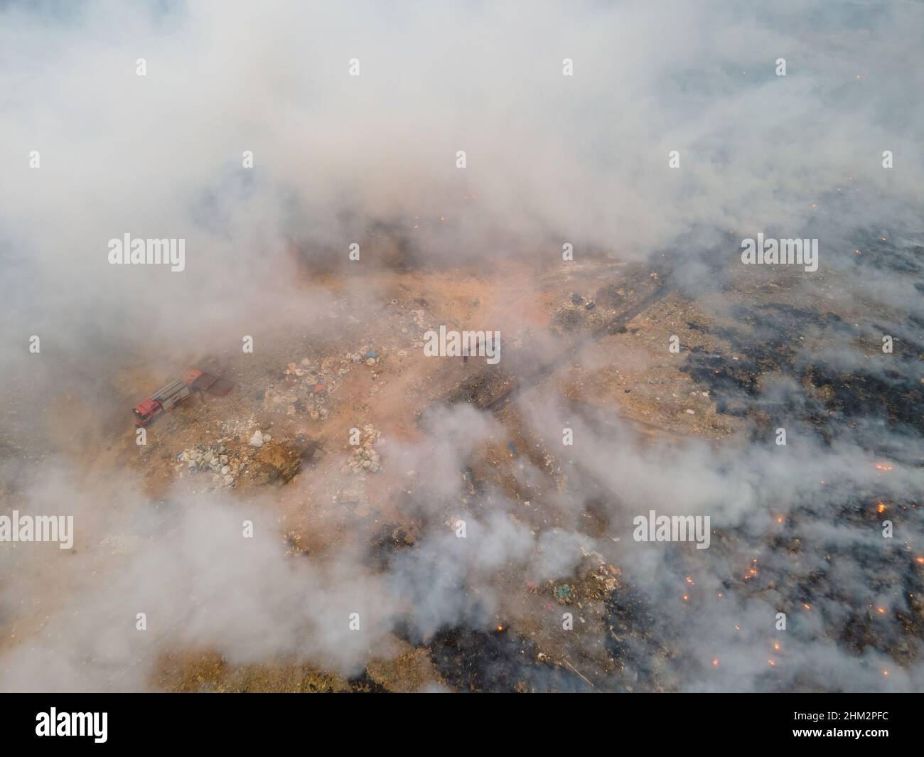 Aerial shot of thick smoke from the burning of a landfill Stock Photo ...