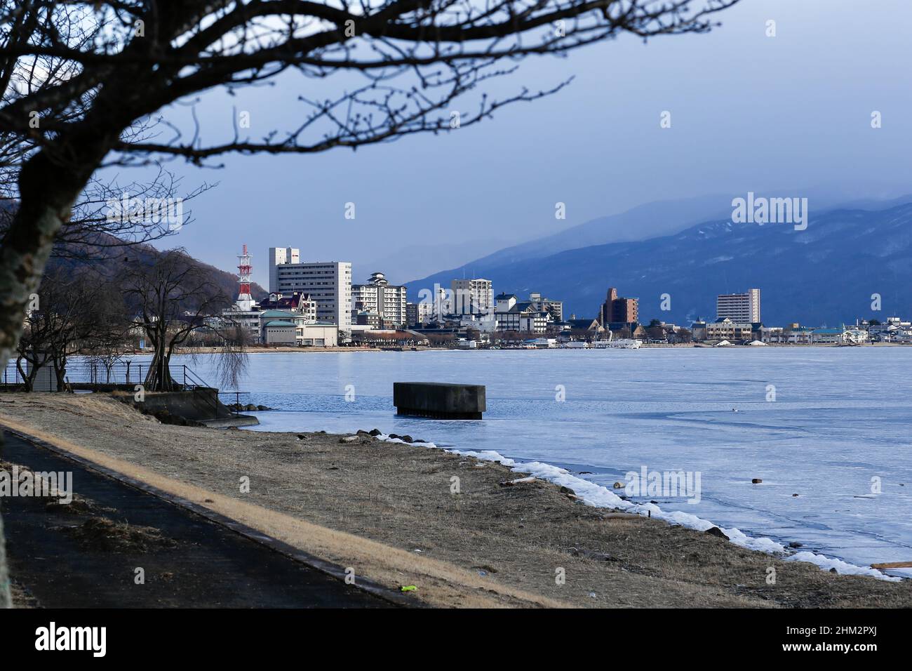 suwa, nagano, japan, 2022/06/02 , Evening view of the frozen Lake Suwa ...