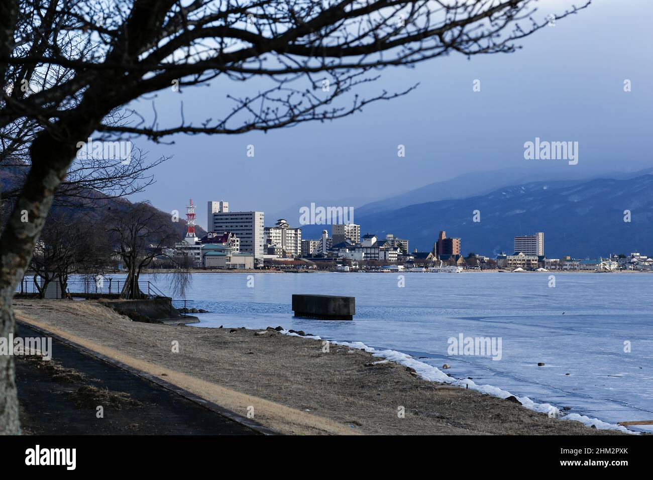 suwa, nagano, japan, 2022/06/02 , Evening view of the frozen Lake Suwa ...