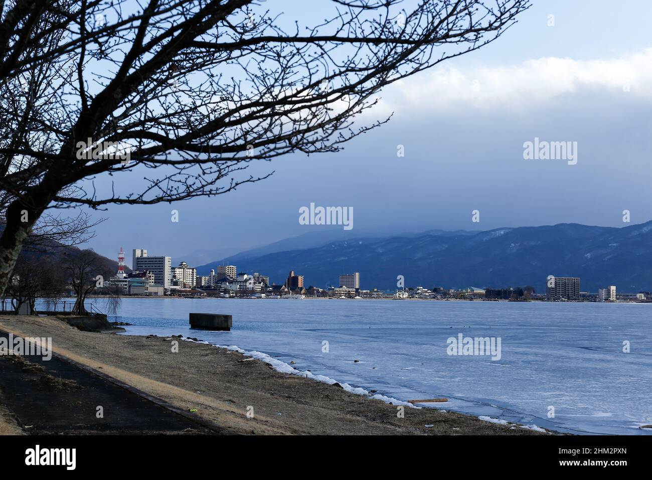 suwa, nagano, japan, 2022/06/02 , Evening view of the frozen Lake Suwa ...