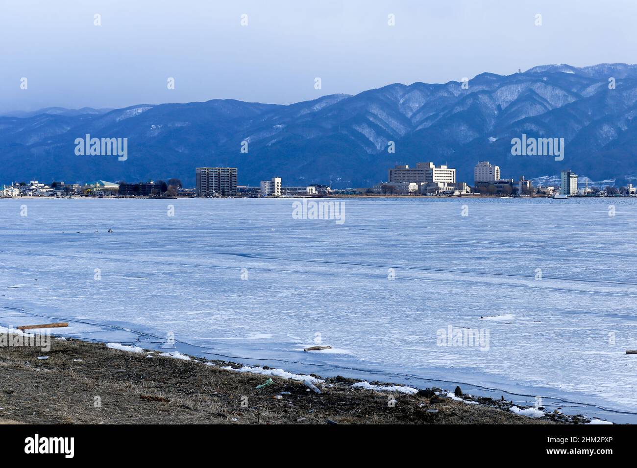 suwa, nagano, japan, 2022/06/02 , Evening view of the frozen Lake Suwa ...