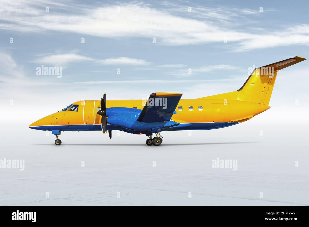 Orange private turboprop airplane isolated on bright background with ...