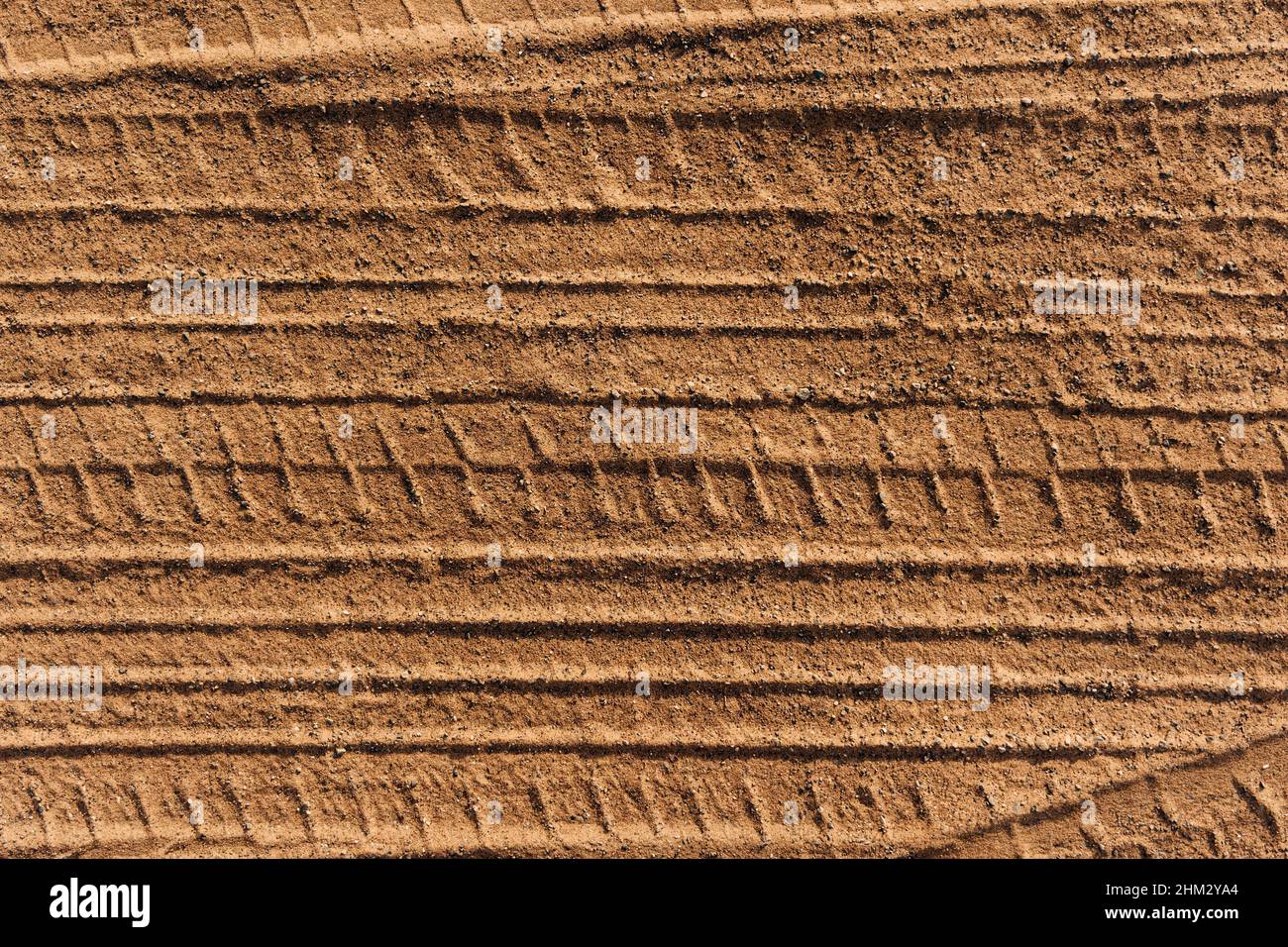 Car wheel tracks on dry sandy ground Stock Photo - Alamy