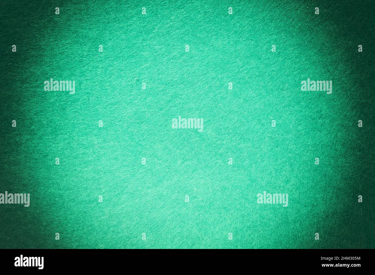 Background made of blue-green felt with a dark rectangular vignette ...