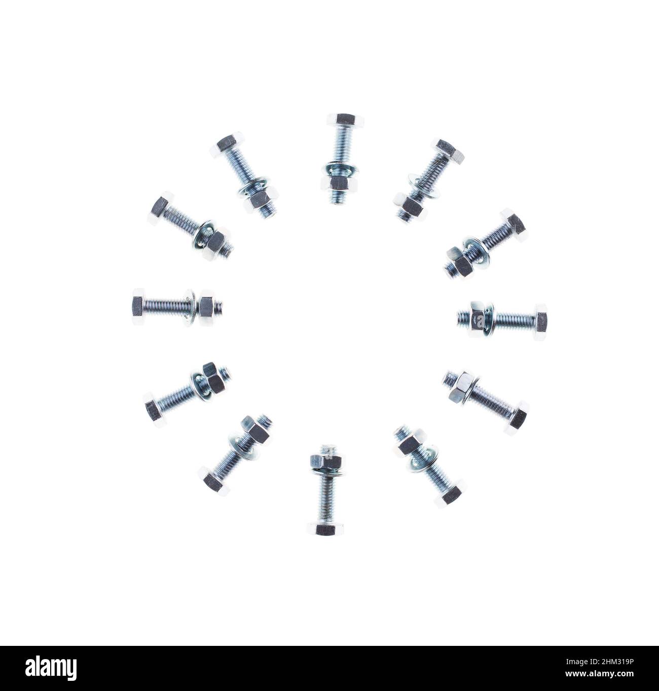 A circle made of steel bolts and nuts isolated on white background ...