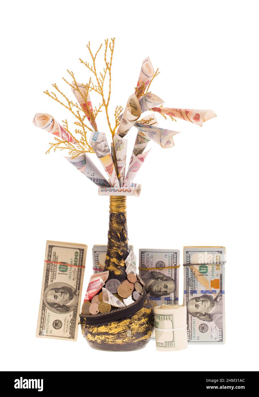 Currency bills on a handmade money tree isolated on white background ...