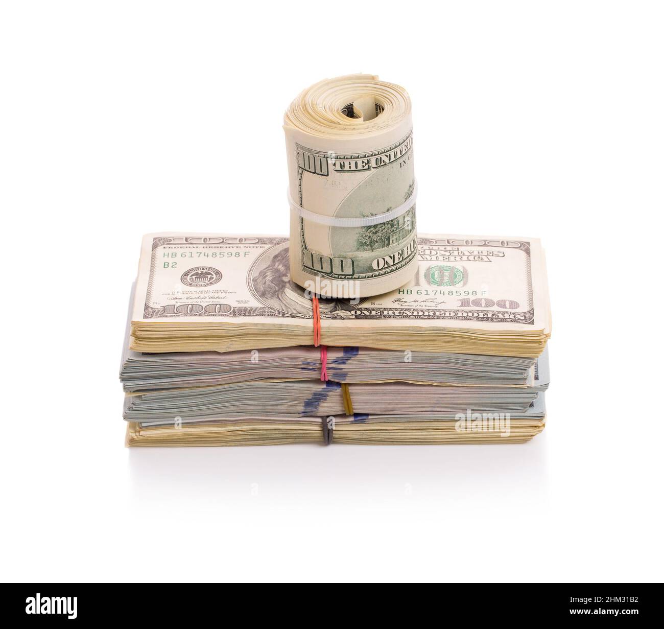 Dollar bills in stacks and rolls isolated on white background Stock ...