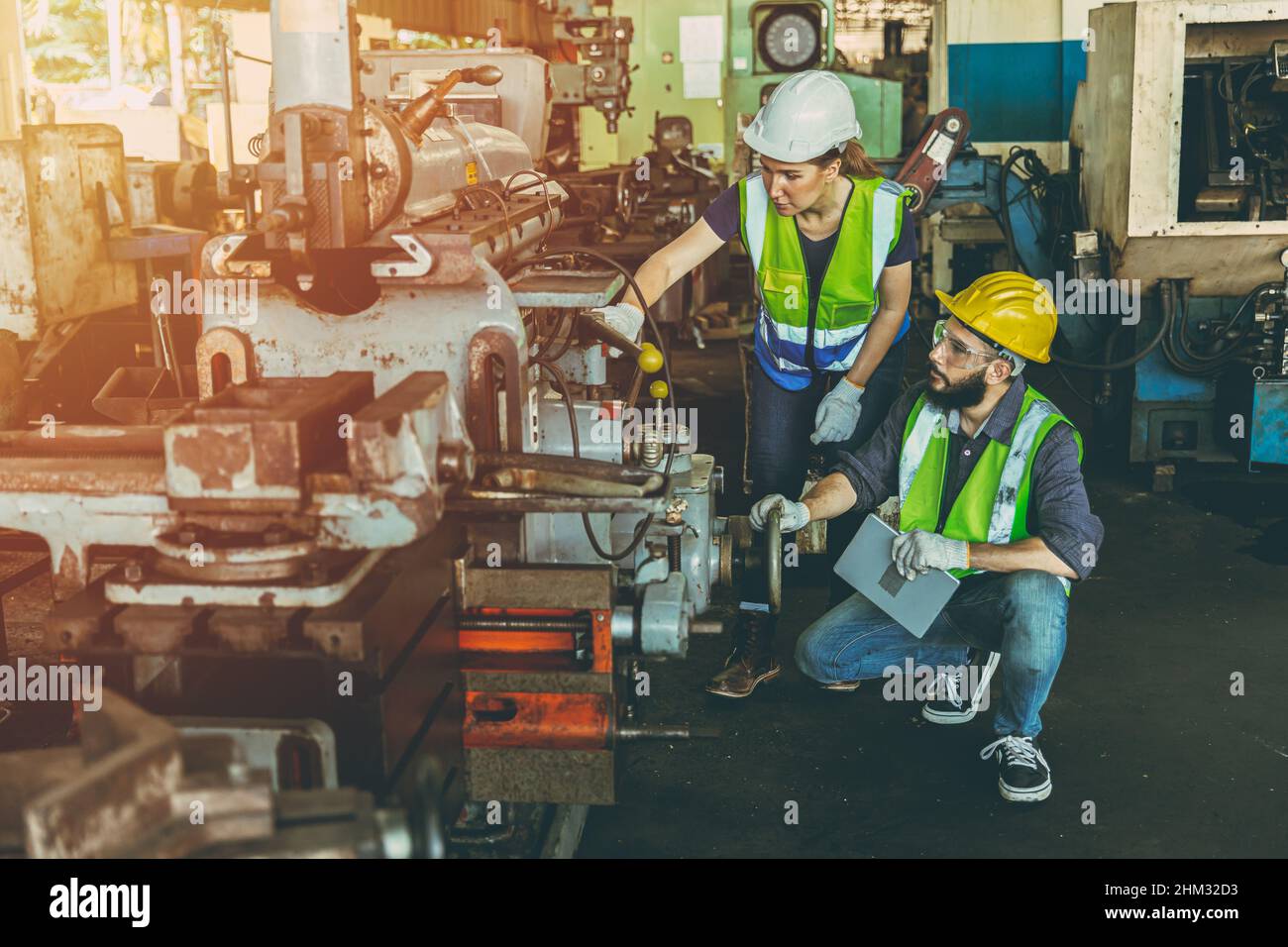 Engineer man and woman team work working together service fix check ...