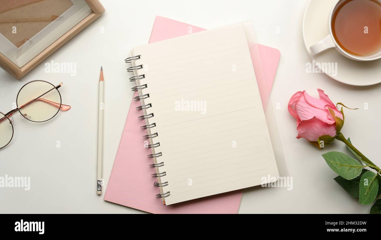 Beautiful feminine female office desk with empty notebook cover mockup ...