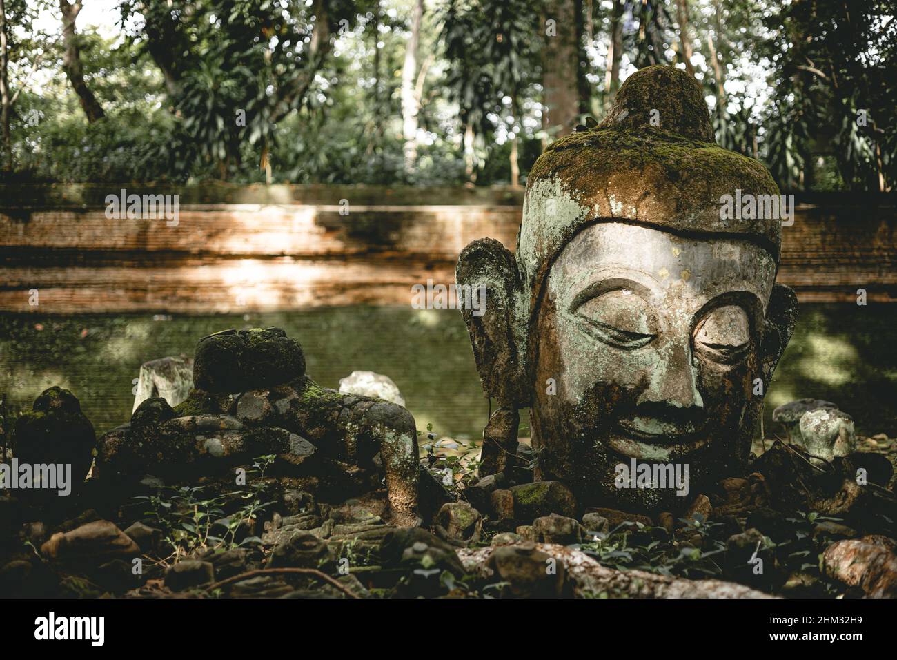 Ancient Buddha statue ruins in Wat Umong Thai temple with cave in ...