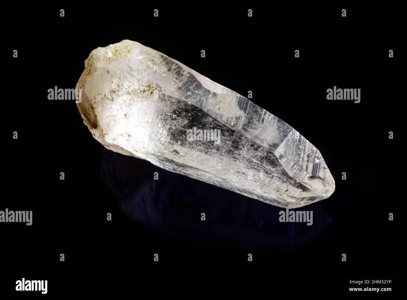 White Quartz stone isolated on black reflective background Stock Photo ...