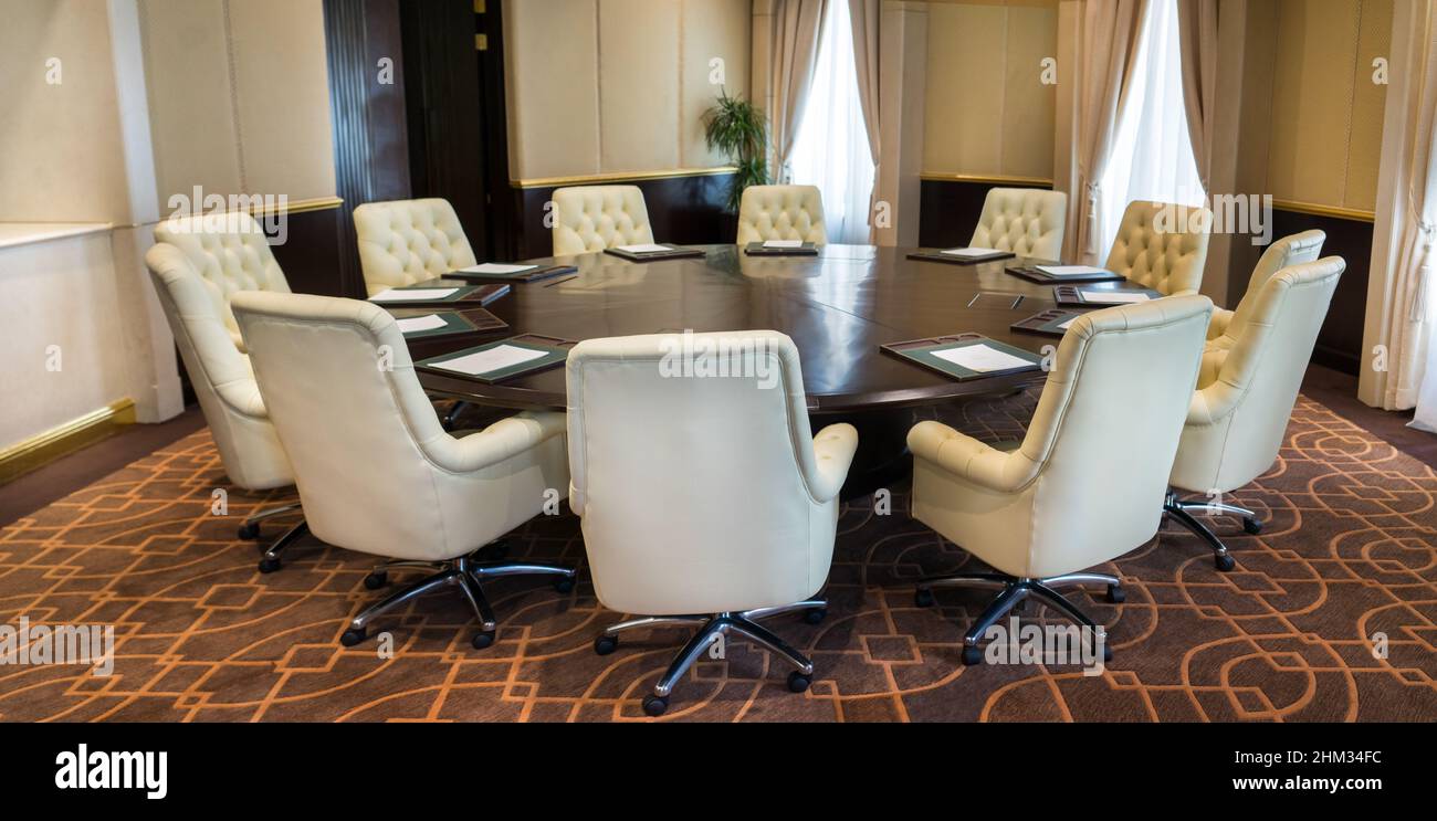 interior of a boardroom - round table and white leather armchairs Stock ...