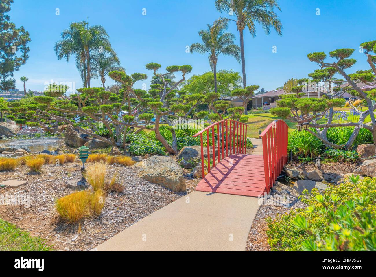 Small arched red bridge in a park at San Marcos, San Diego, California ...