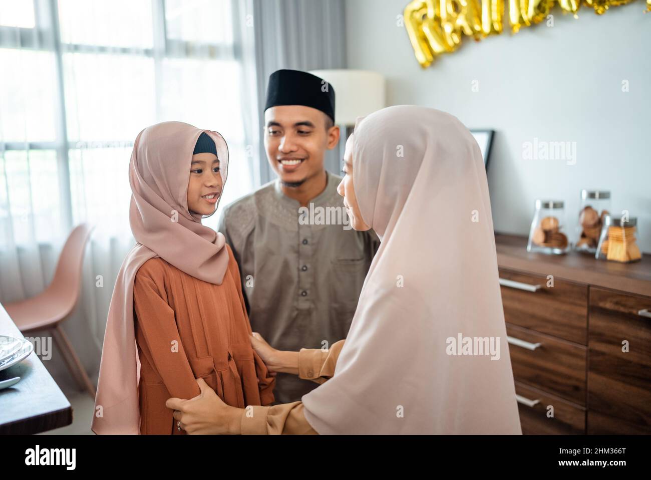 muslim parent having conversation with their little girl Stock Photo ...