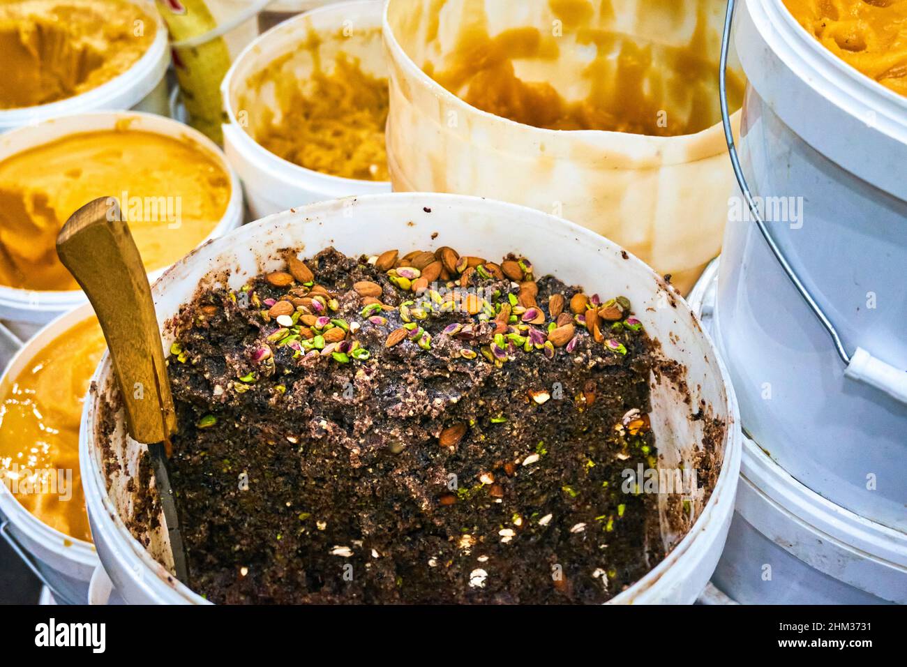 A sample of the variety of honey available. This sample is filled with ...