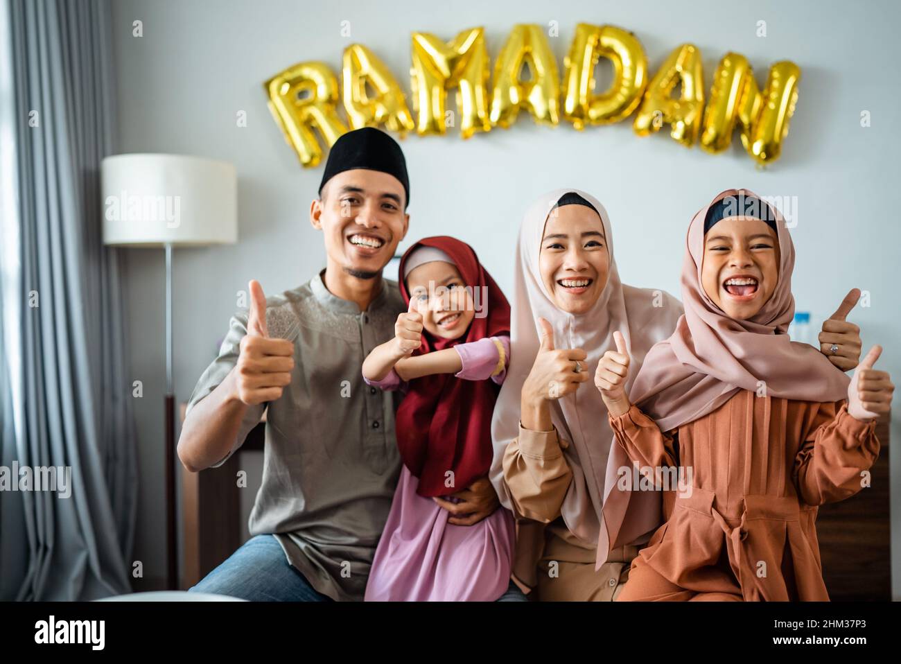 beautiful muslim family portrait together smiling to camera Stock Photo ...
