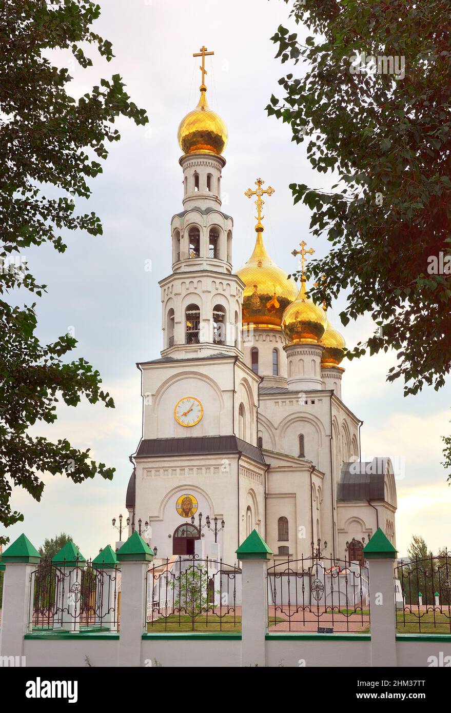 The high bell tower and golden domes of the temple in the Russian ...