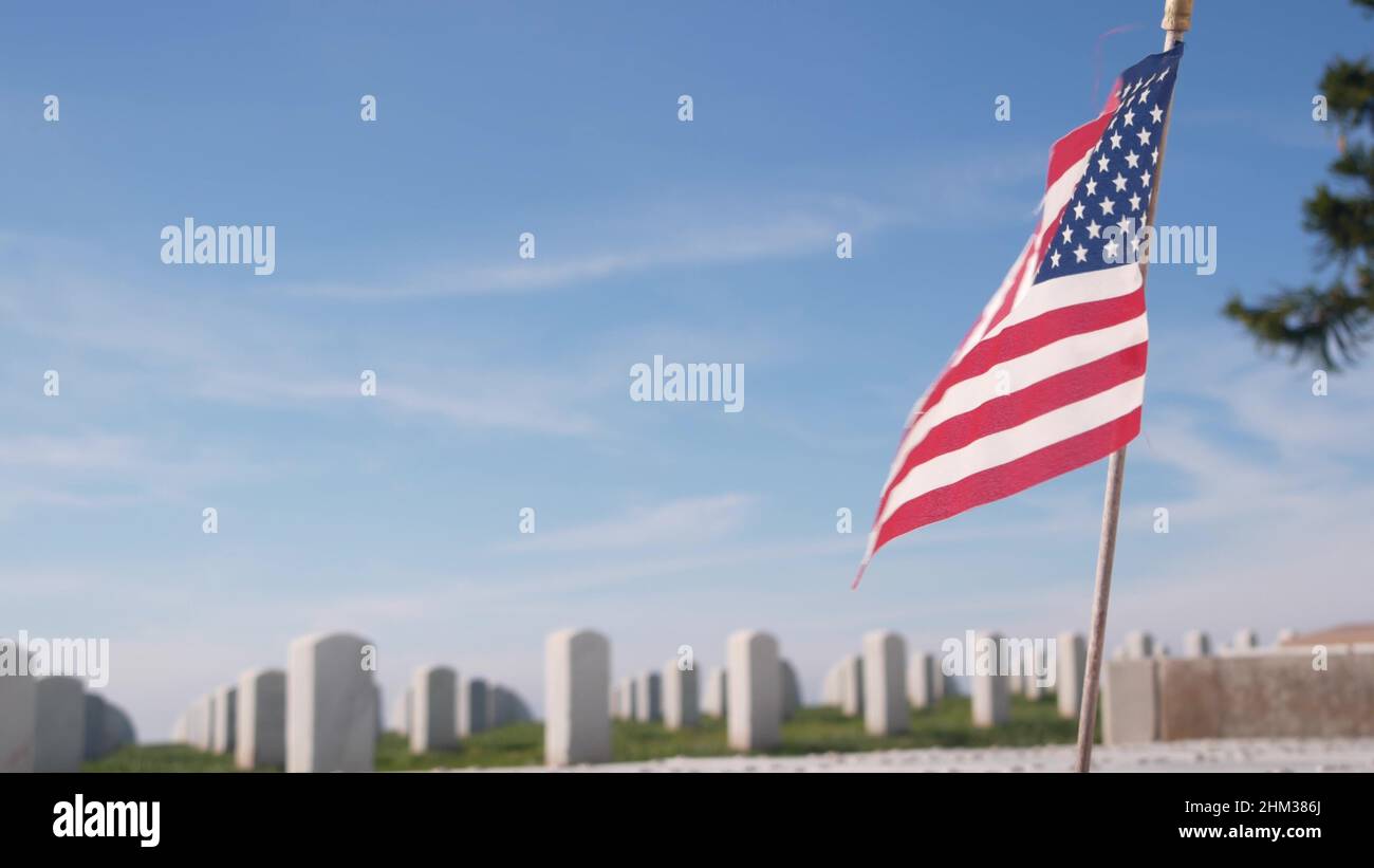 Tombstones and american flag, national memorial cemetery, military ...