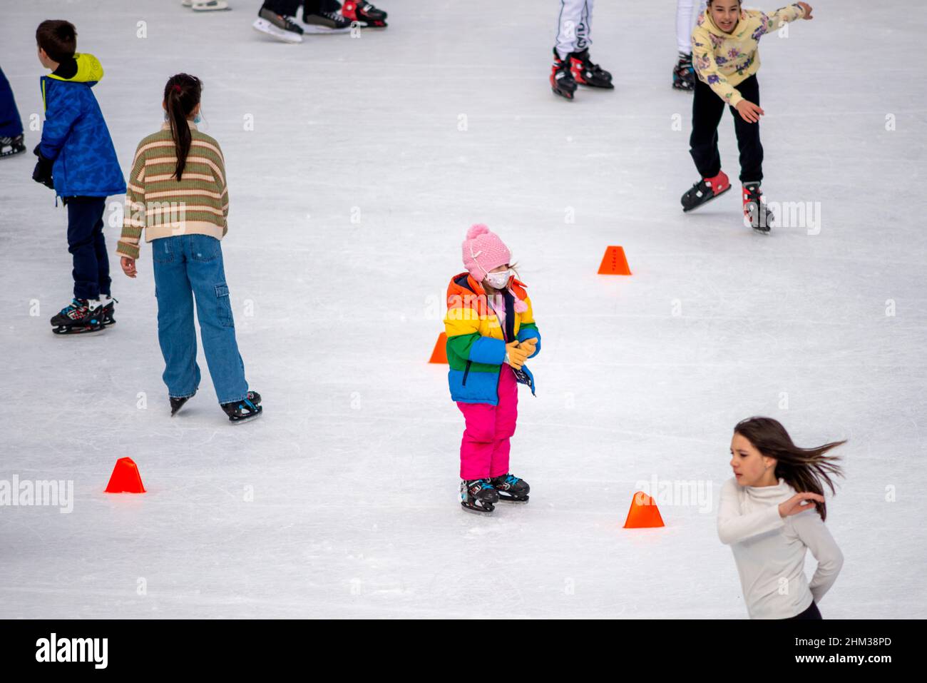 Children ice skating at an outdoor ice skating rink Stock Photo - Alamy