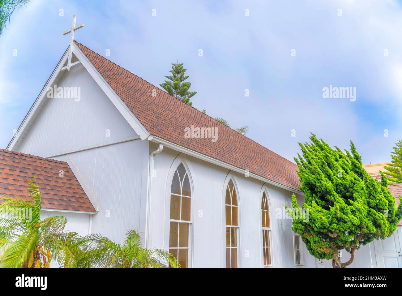 Side exterior of a chapel with trees outside at Carlsbad, San Diego ...