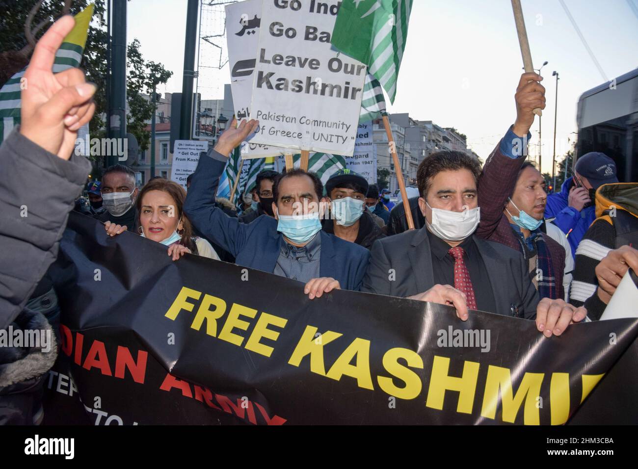 Pakistanis living in Greece seen marching waving flags of Kasmir in the ...