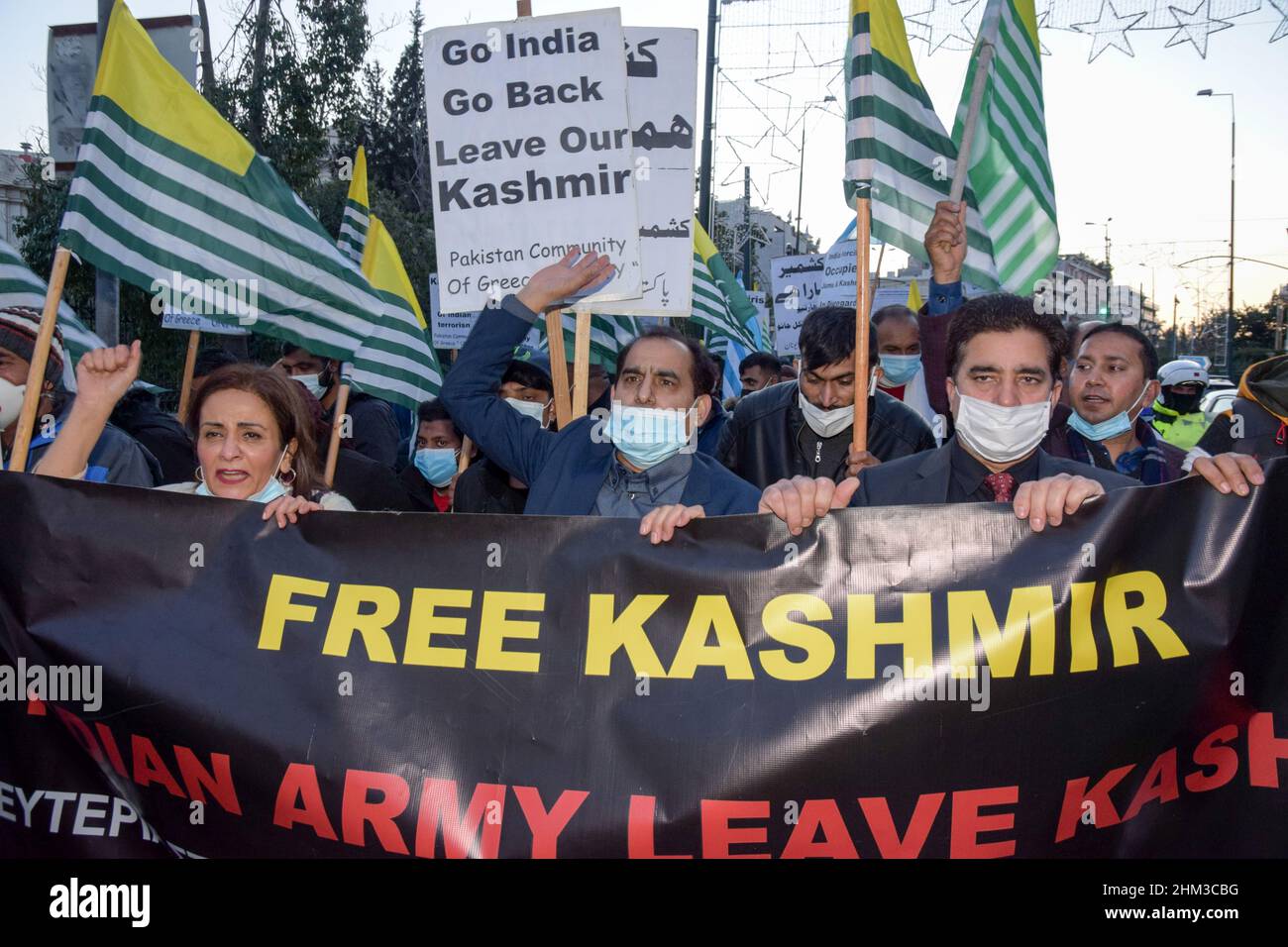 Pakistanis living in Greece seen marching waving flags of Kasmir in the ...