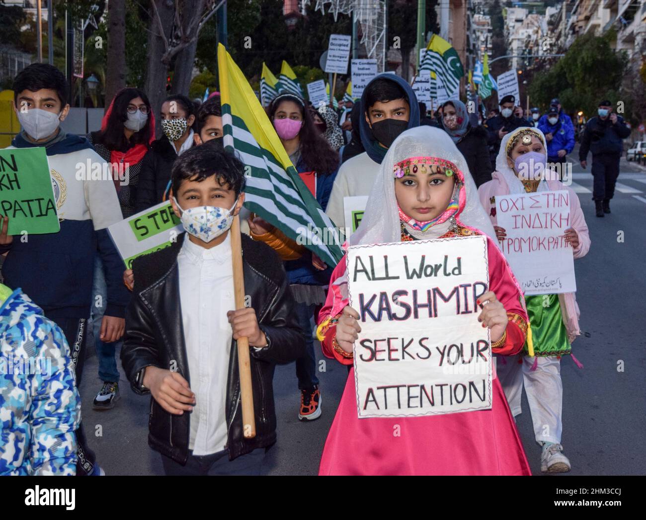 Teenagers march holding signs during a rally of the Pakistanis living ...