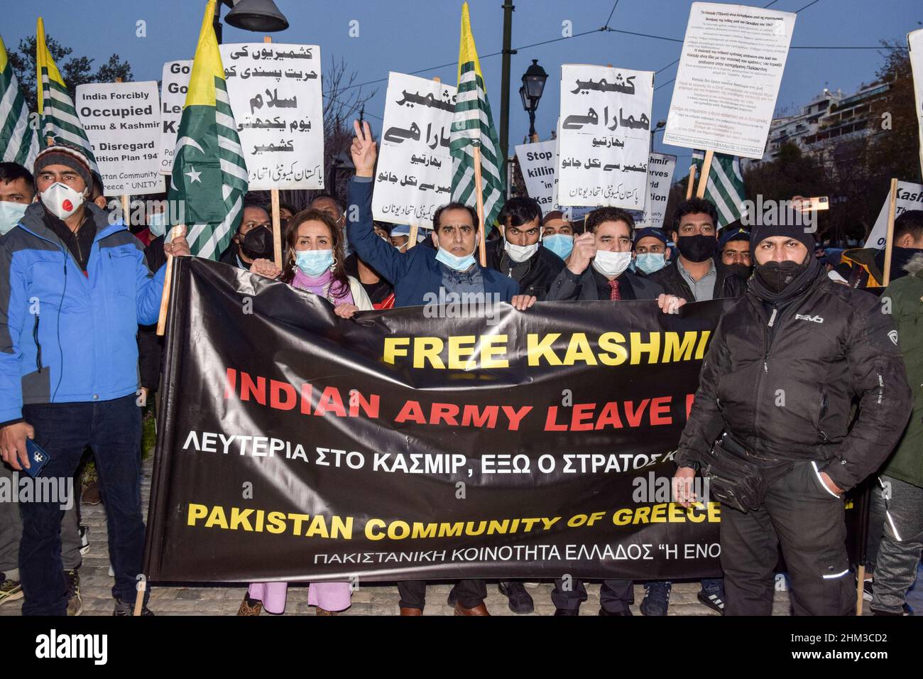 Pakistanis living in Greece seen marching waving flags of Kasmir in the ...