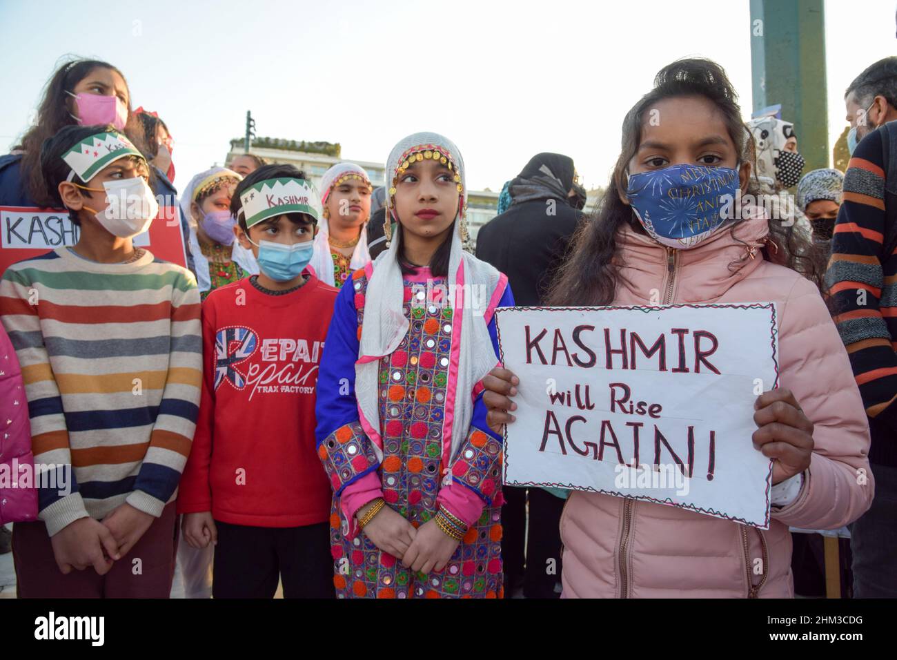 Teenagers and kids hold signs during a rally of the Pakistanis living ...