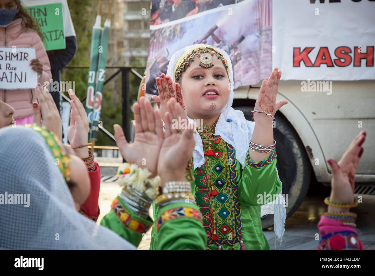 Young girls dressed traditionally perform during the rally of the ...