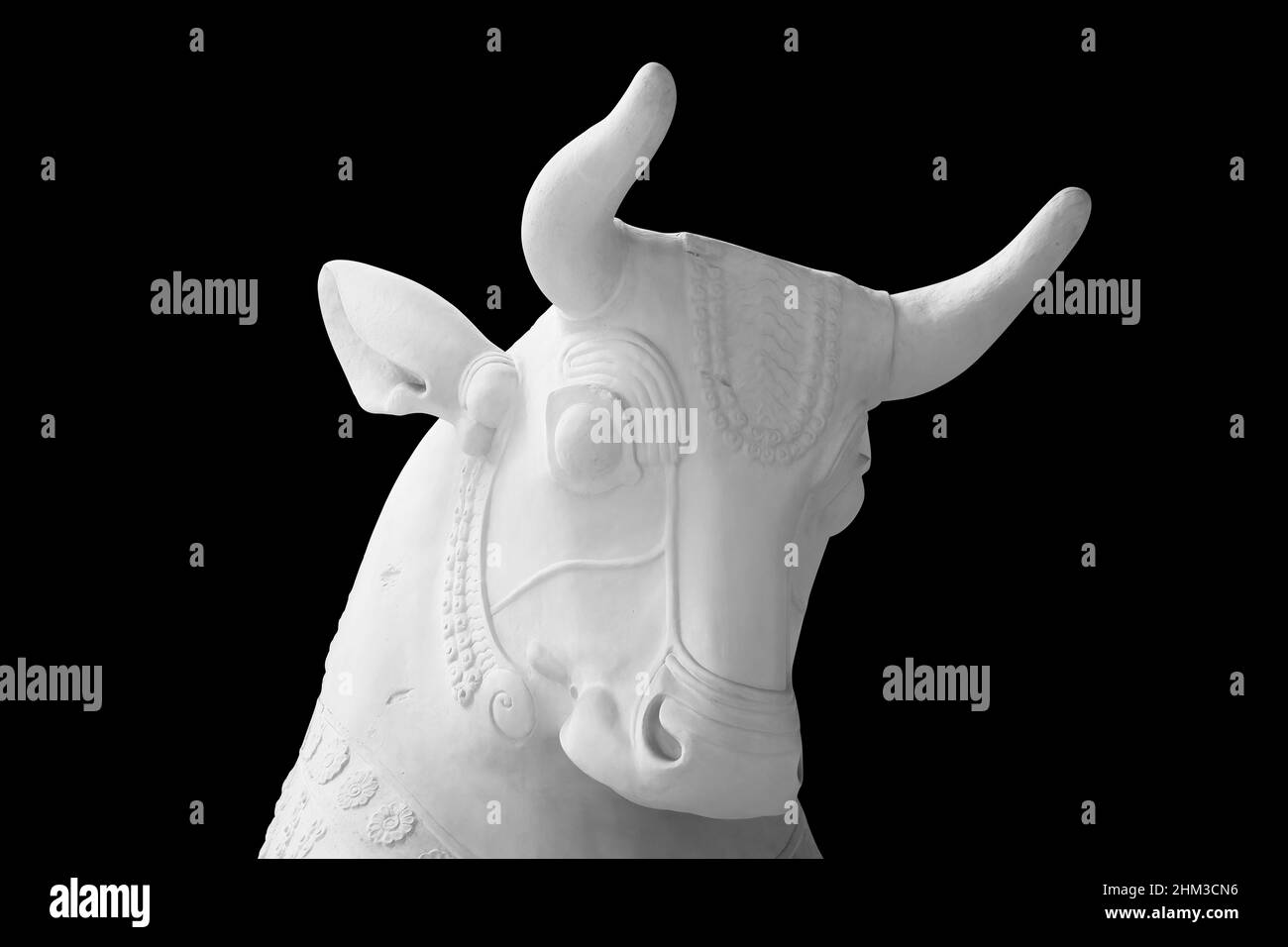Stone statue. Bull isolated on a black background with clipping path ...