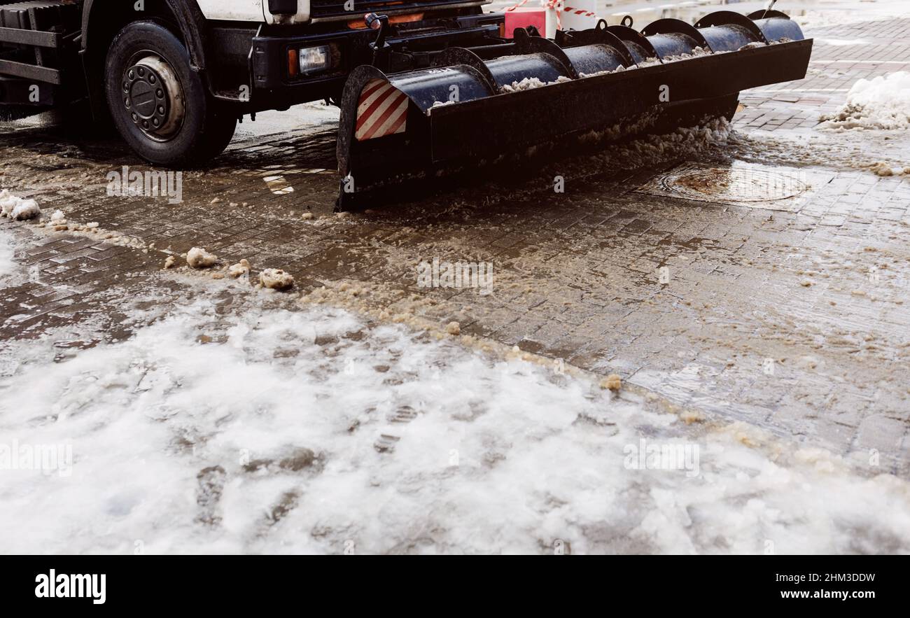 cargo vehicles clean the sidewalk from snow. Clean streets. Winter in ...