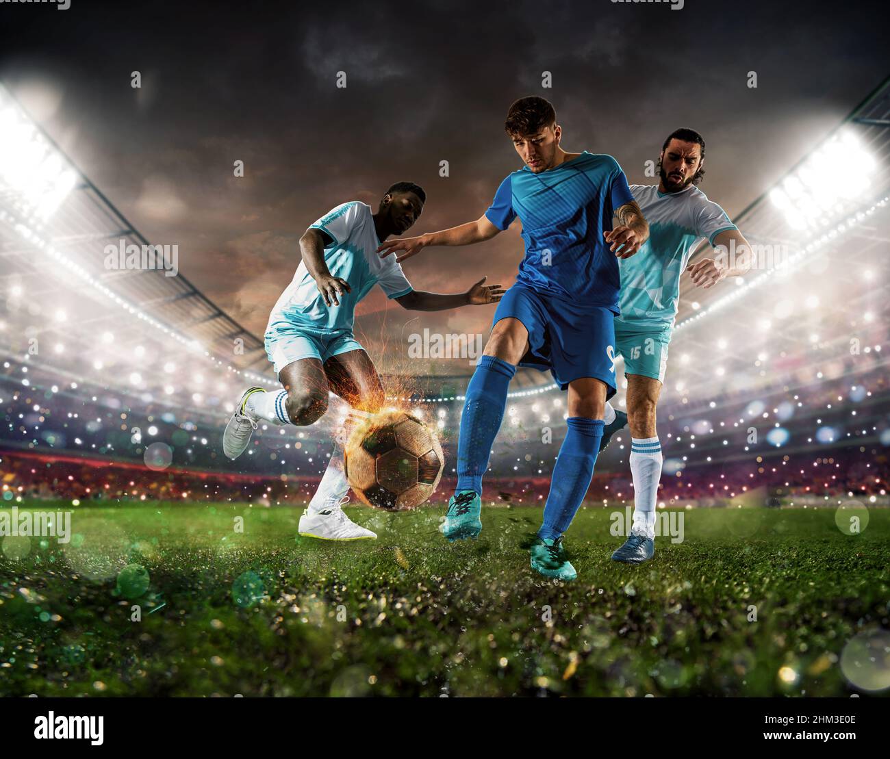 Close up of a football action scene with competing soccer players at ...