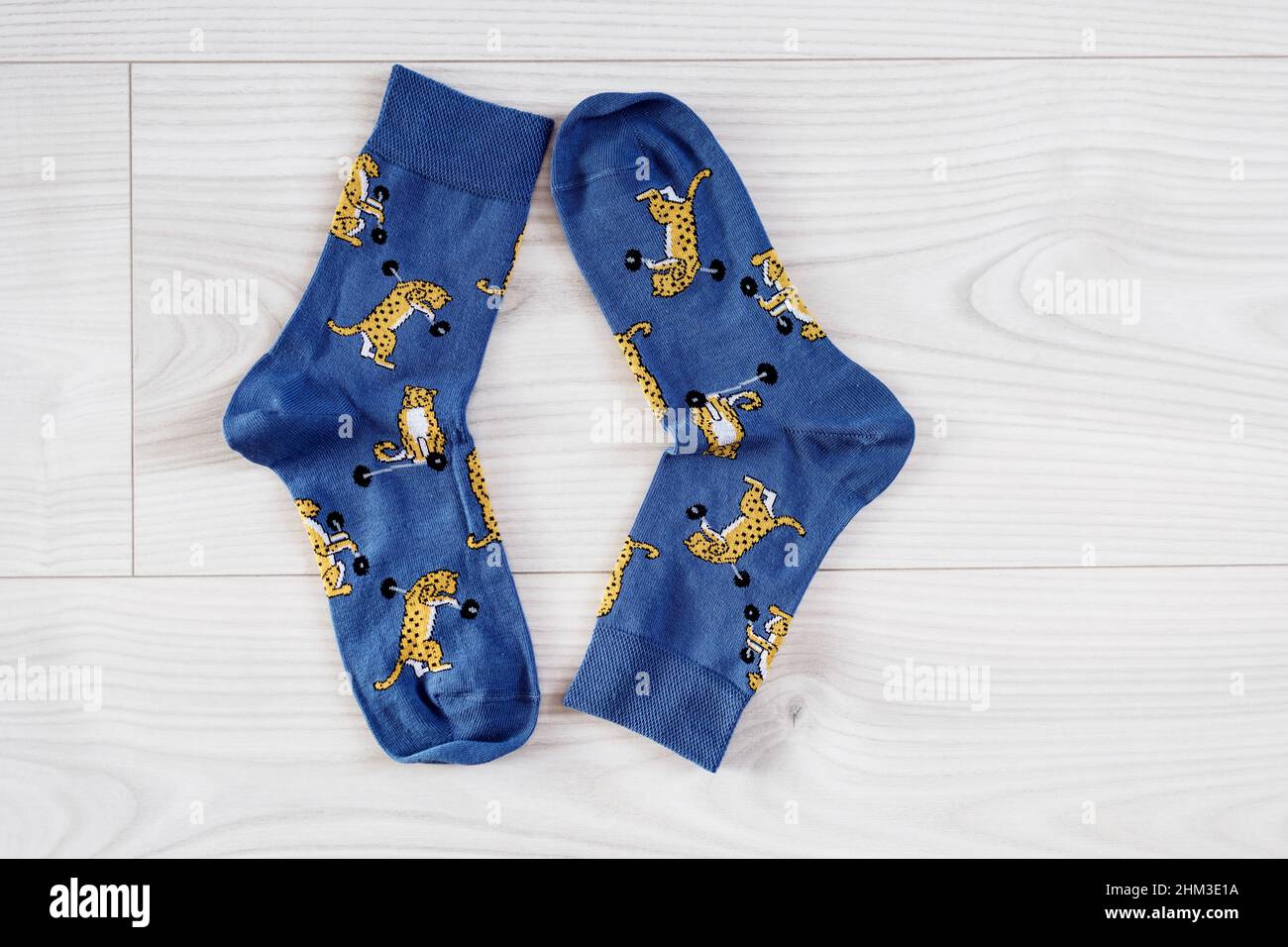 two colored funny men's socks lie on wooden background. flat lay Stock ...