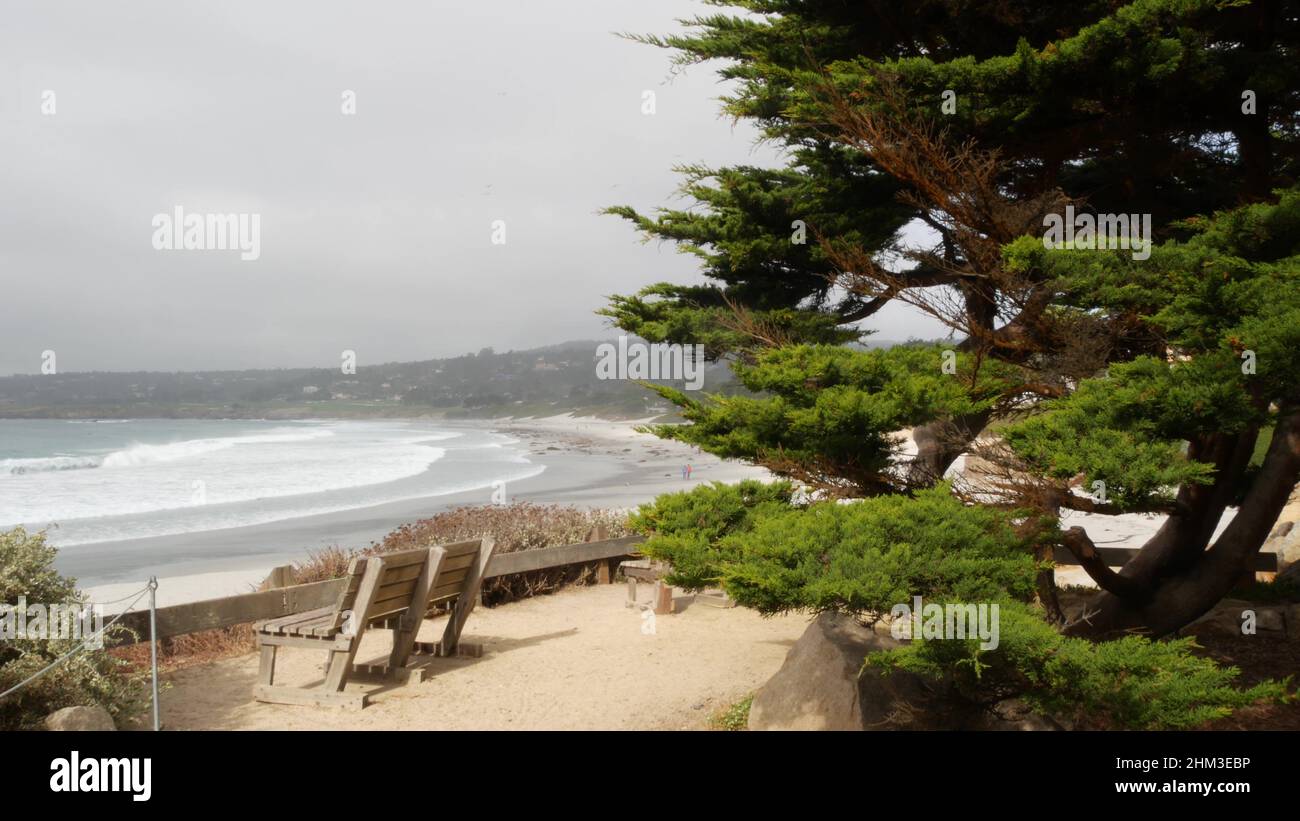 Empty wooden bench, rest on trail path, walkway or footpath. Carmel ...