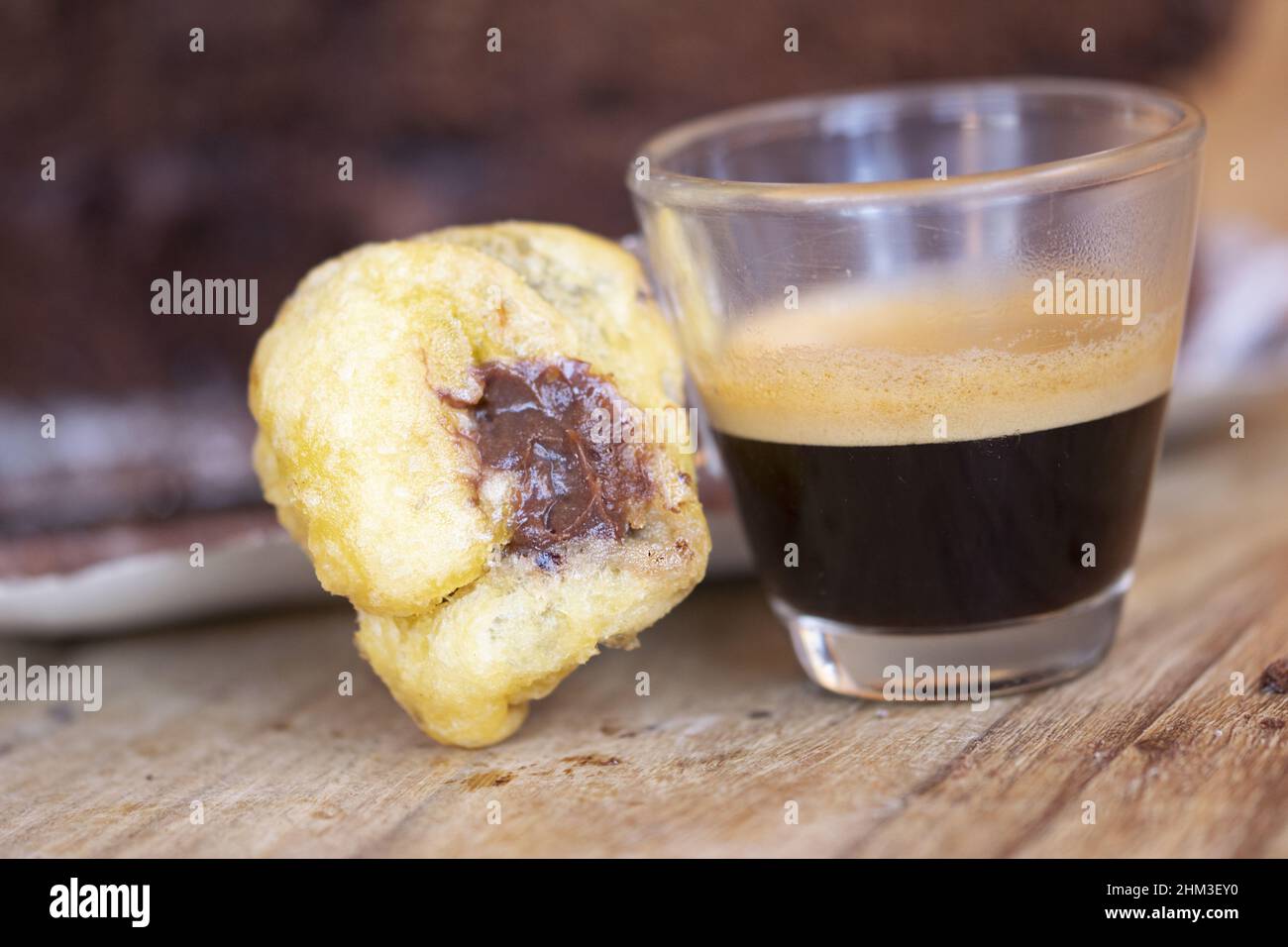 breakfast with espresso coffee and chocolate cream puff Stock Photo - Alamy
