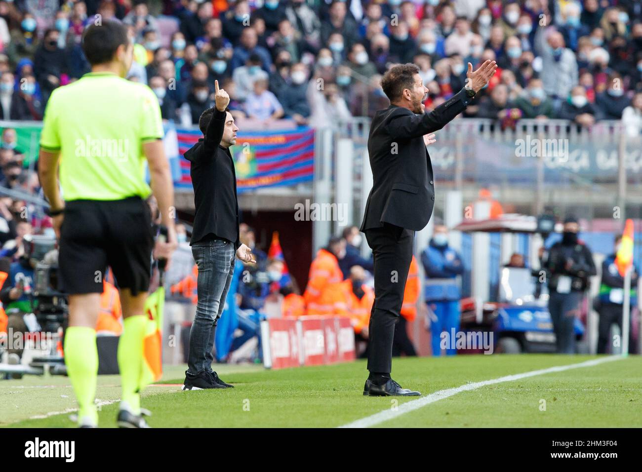 Barcelona, Spain. 06th Feb, 2022. Xavi Hernandez of FC Barcelona with Diego Pablo Simeone of ...