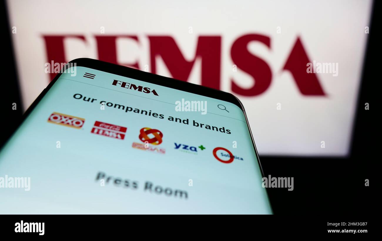 Mobile phone with website of Mexican company Fomento Econmico Mexicano ...