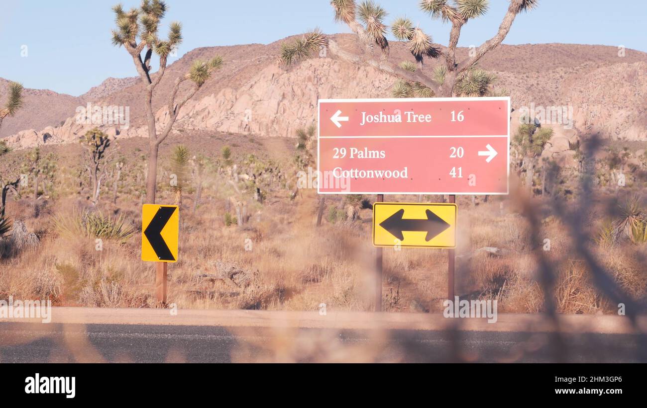 Crossroad sign with direction arrows on road intersection, California ...