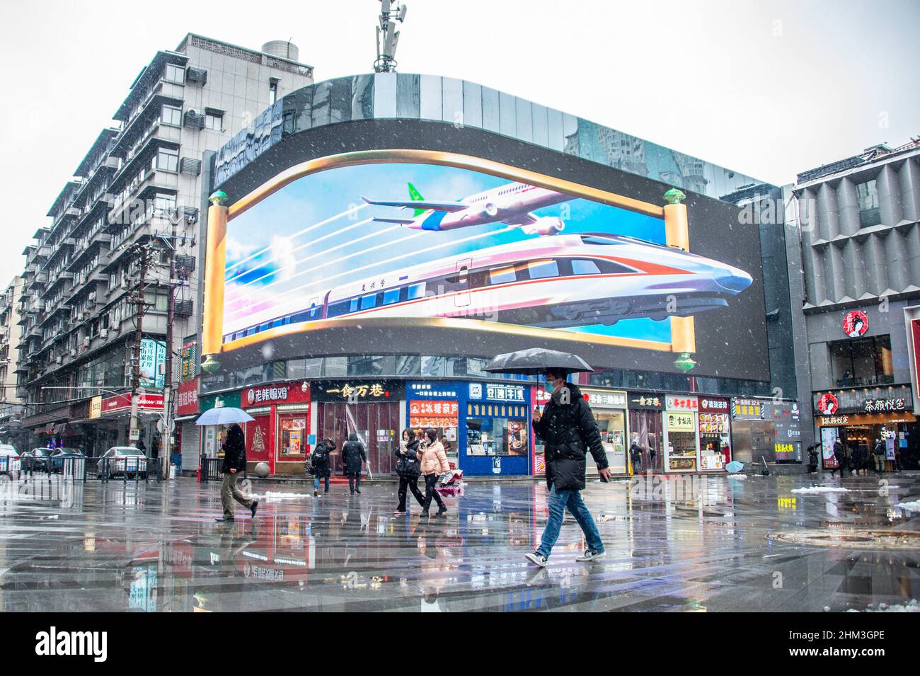 Wuhan, China's Hubei Province. 7th Feb, 2022. People walk on a street ...