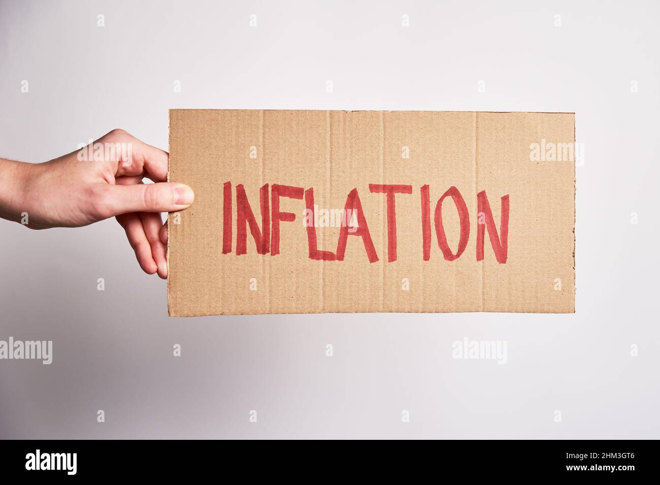 World economic crisis and inflation concept, Woman hold paper sheet ...