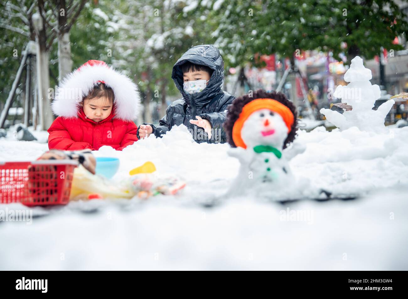 Wuhan, China's Hubei Province. 7th Feb, 2022. Children play with snow ...