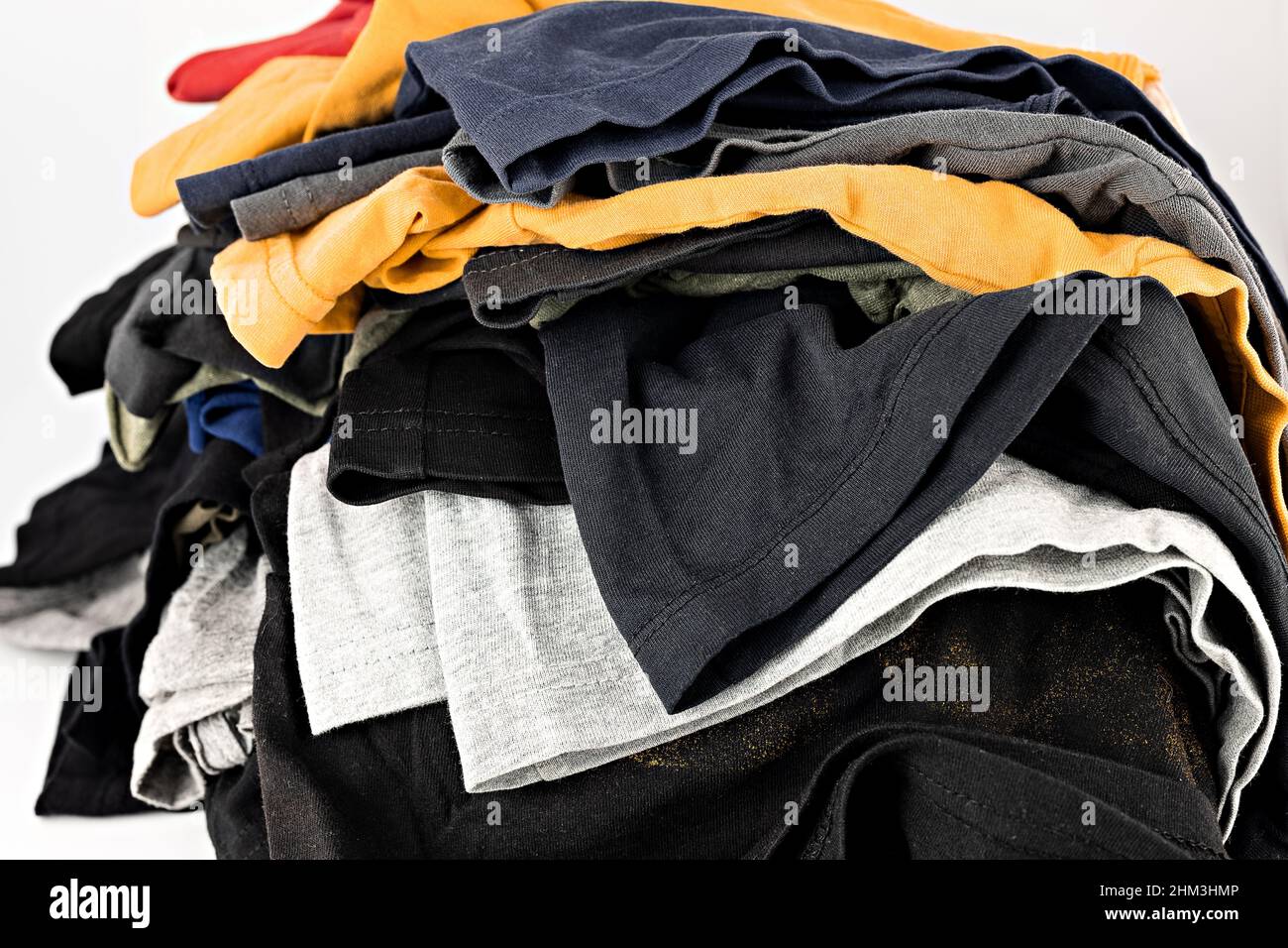heap of t-shirts. serigraphy production. printing images on tshirts in ...