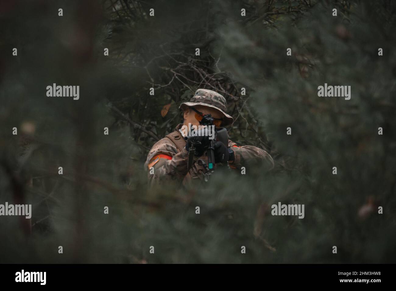 Real soldier in the forest with a special uniform Stock Photo - Alamy