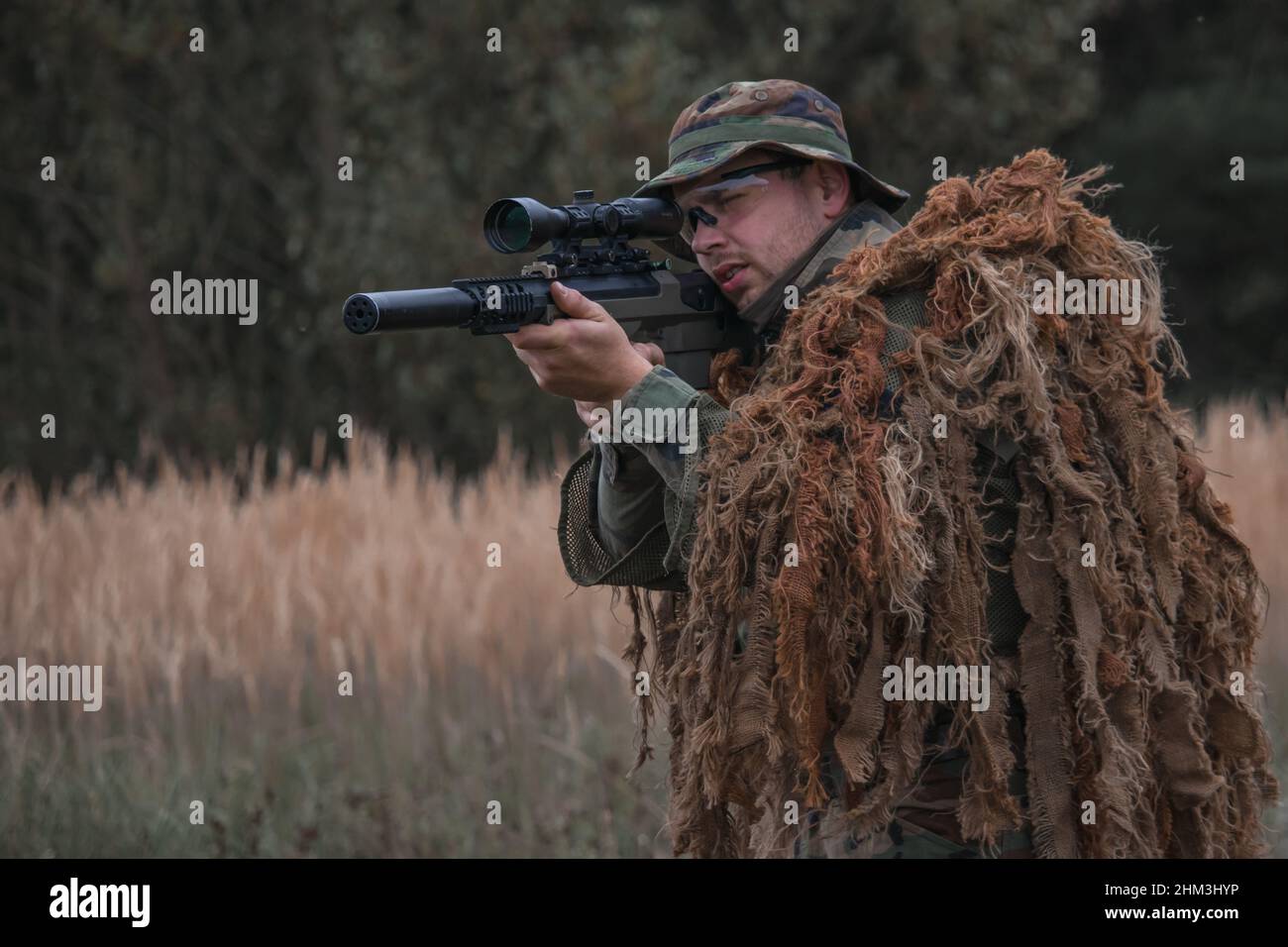 Real soldier in the forest with a special uniform Stock Photo - Alamy
