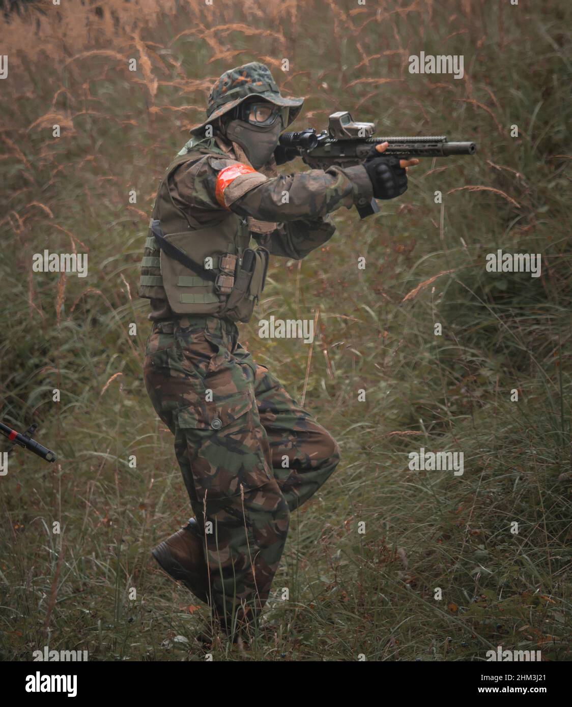 Real soldier in the forest with a special uniform Stock Photo - Alamy