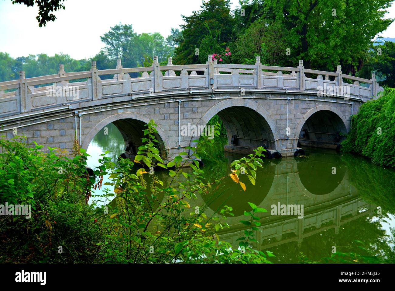 Landscape view of an Asian style bridge Stock Photo - Alamy