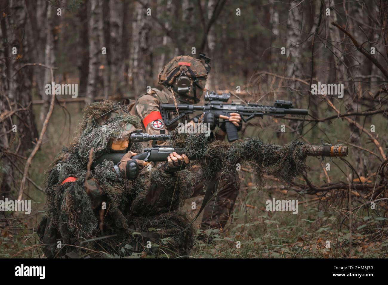 Real soldier in the forest with a special uniform Stock Photo - Alamy