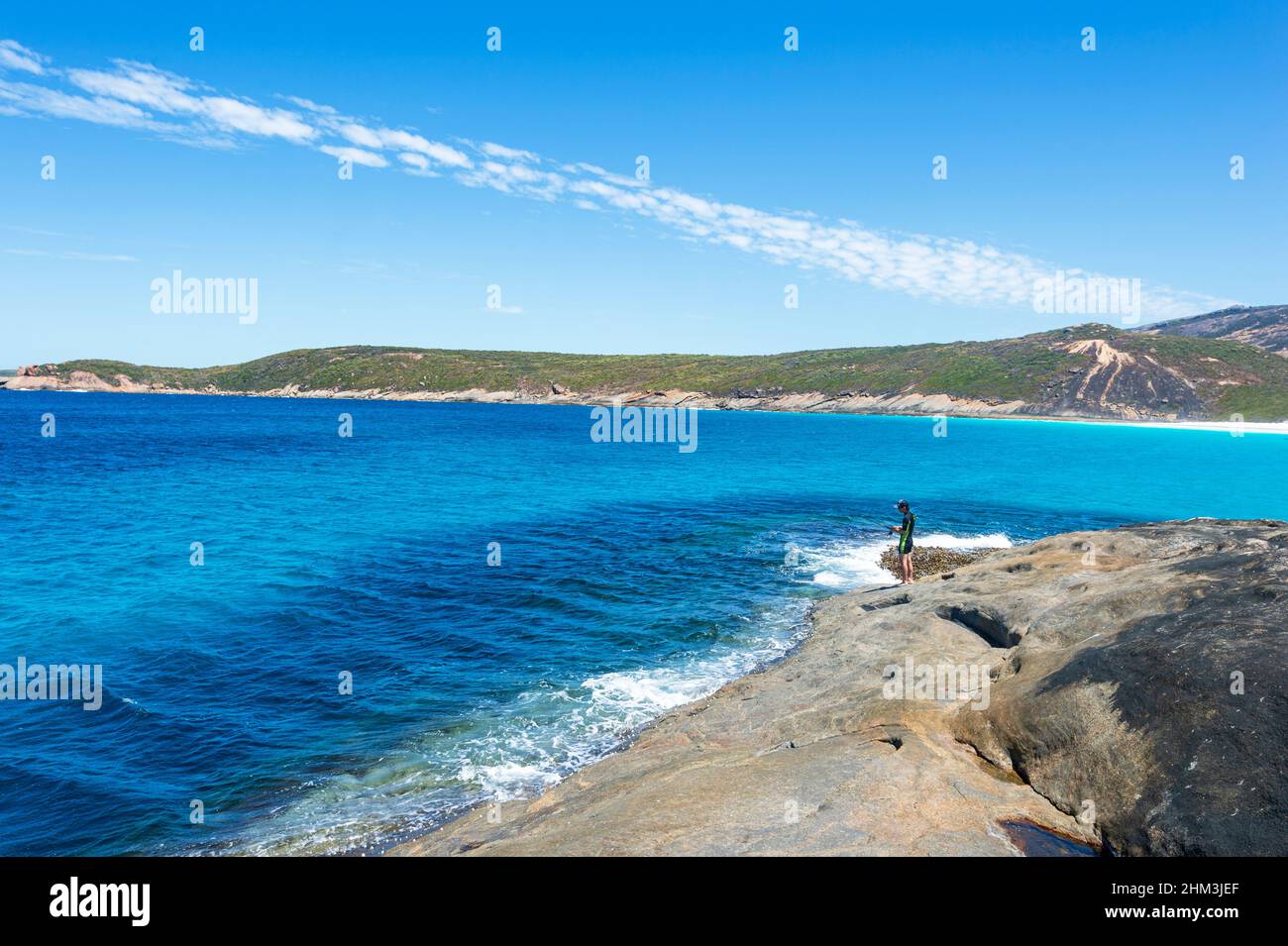 Fisherman rock fishing at the popular iconic Hellfire Bay, Cape Le ...